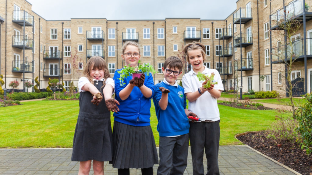 Menston Primary School children enjoy planting at The Spindles, an ...
